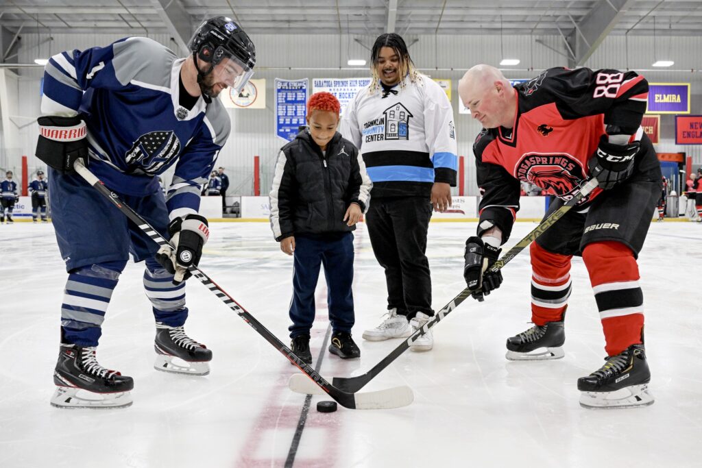 Dropping the puck helps bring Christmas cheer to New York kids - IAFF